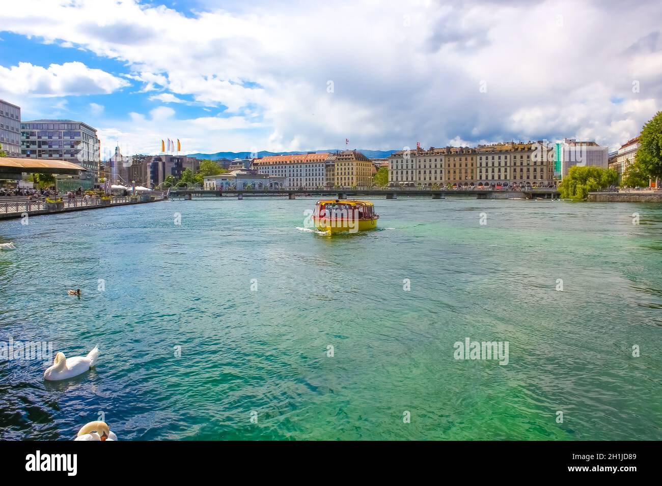 Lake Geneva. Panoramic view of harbor district with blue sky and clouds ...