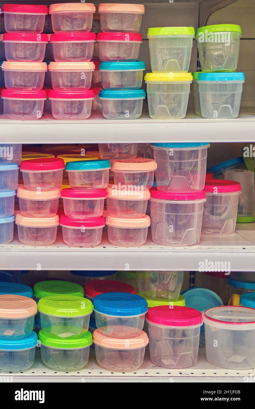 Plastic dishes and containers are sold on the shelves in the store ...