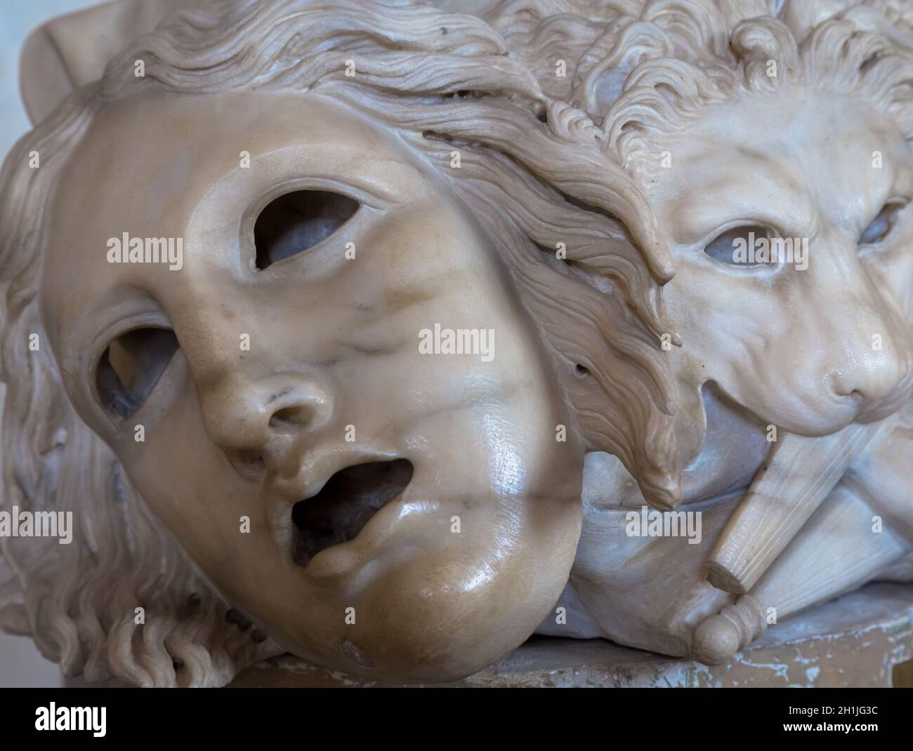 Ancient theatre mask, made of marble, located at the base of a Roman ...