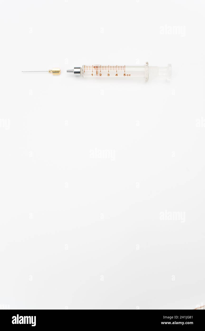 isolated sterilized glass injection syringe on a white surface Stock ...