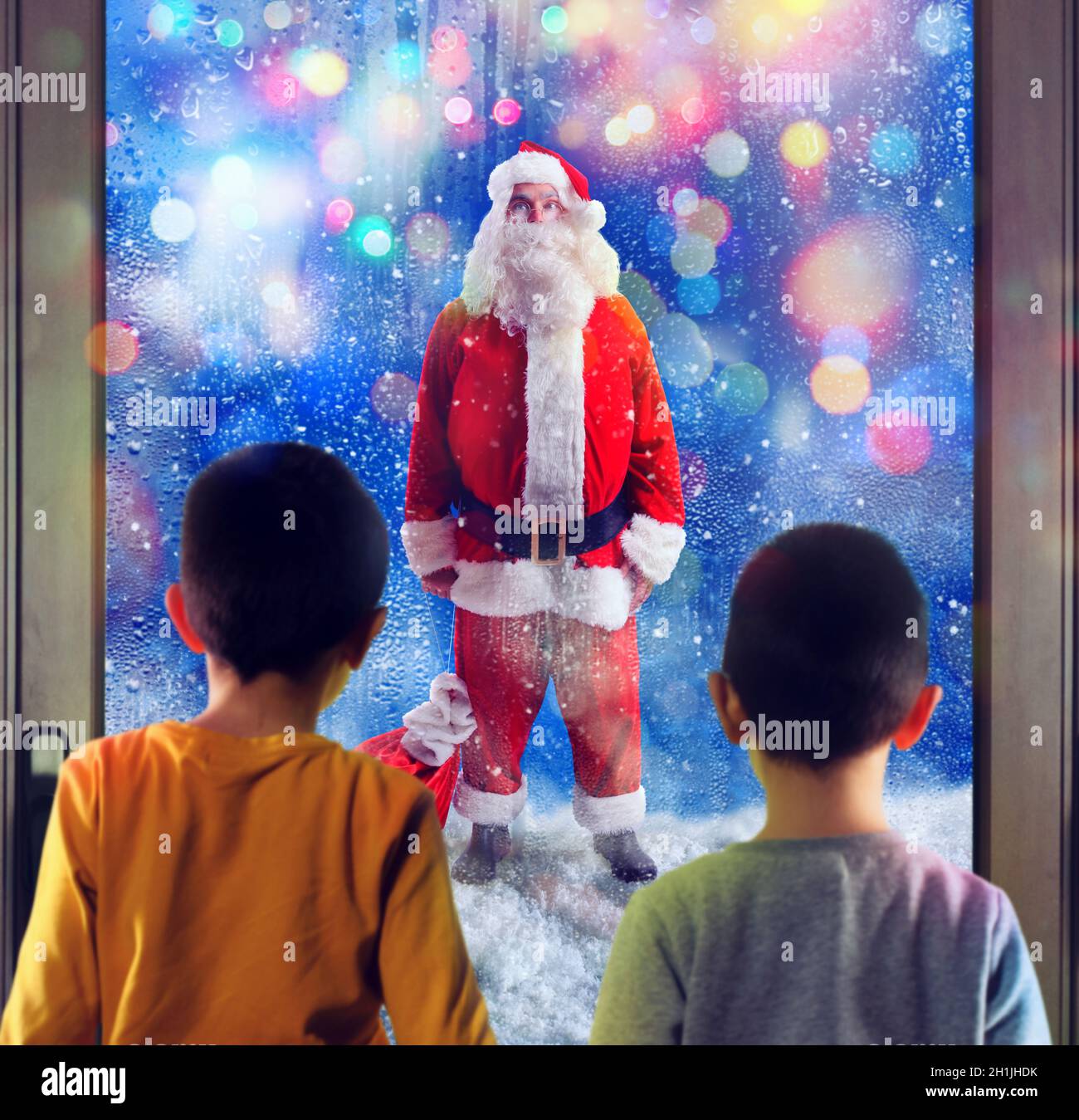 Children observes Santa Claus through the windows Stock Photo - Alamy