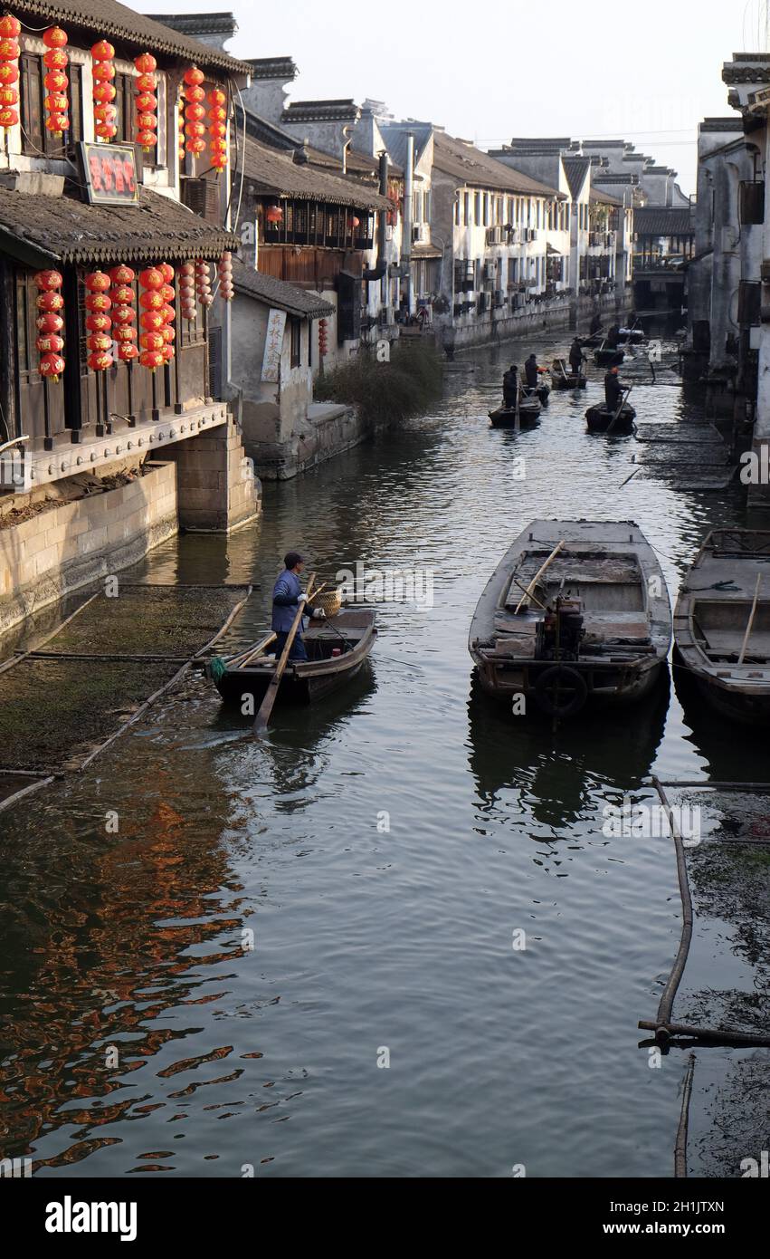 Tourist boats on the water canals of Xitang Town in Zhejiang Province ...