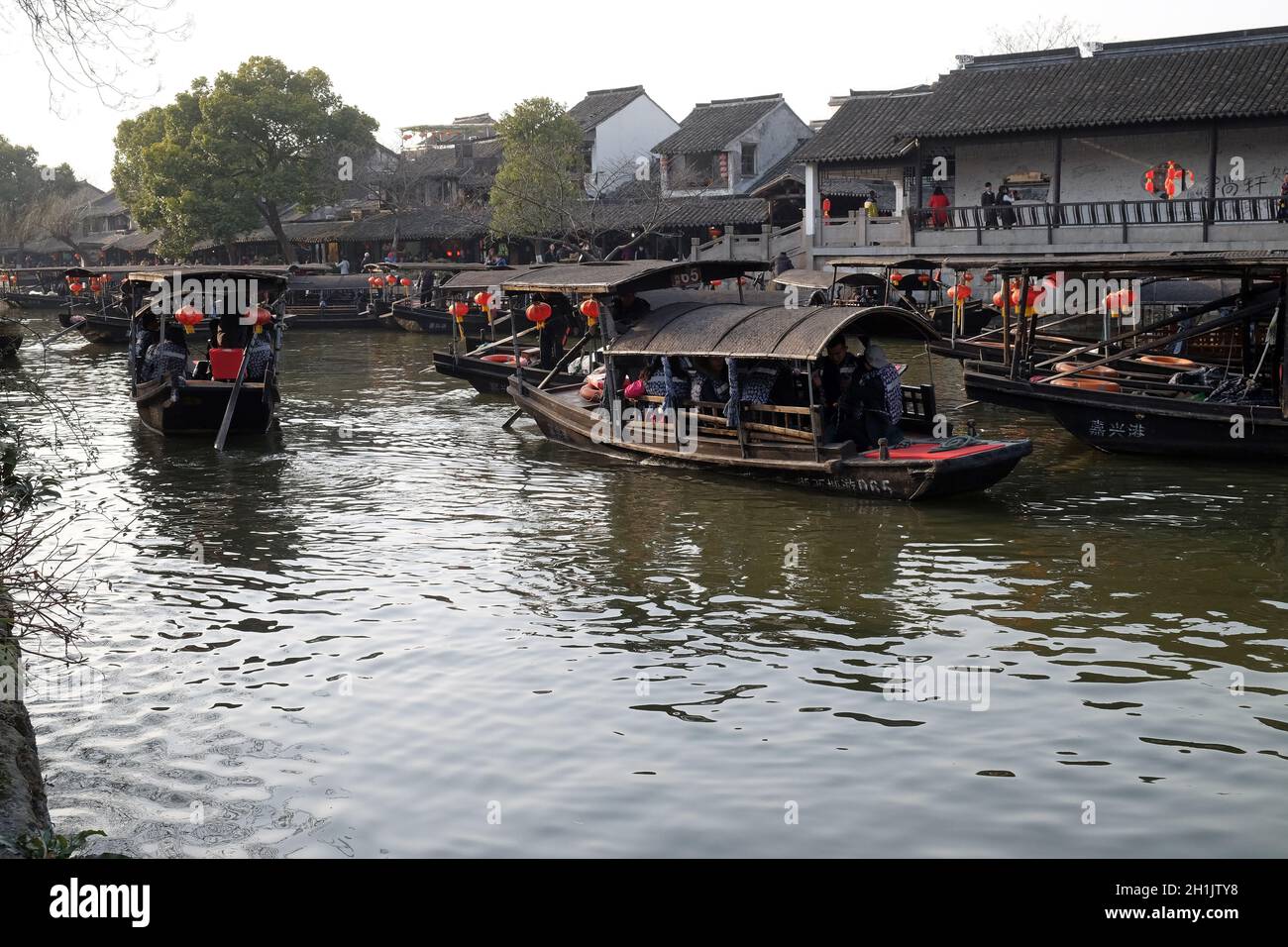 Tourist boats on the water canals of Xitang Town in Zhejiang Province ...