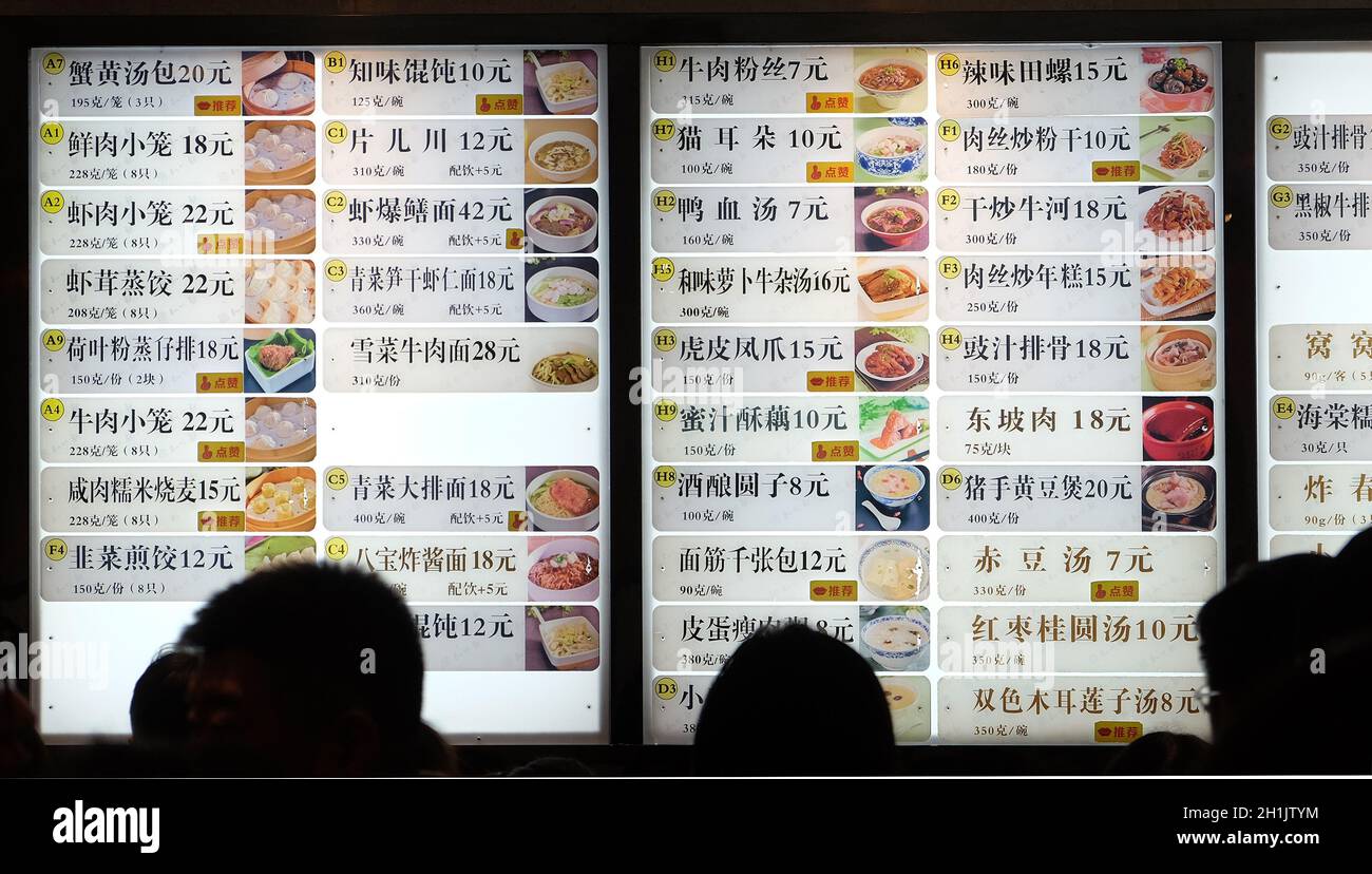 Showcase with traditional Chinese dishes and price in a restaurant in ...