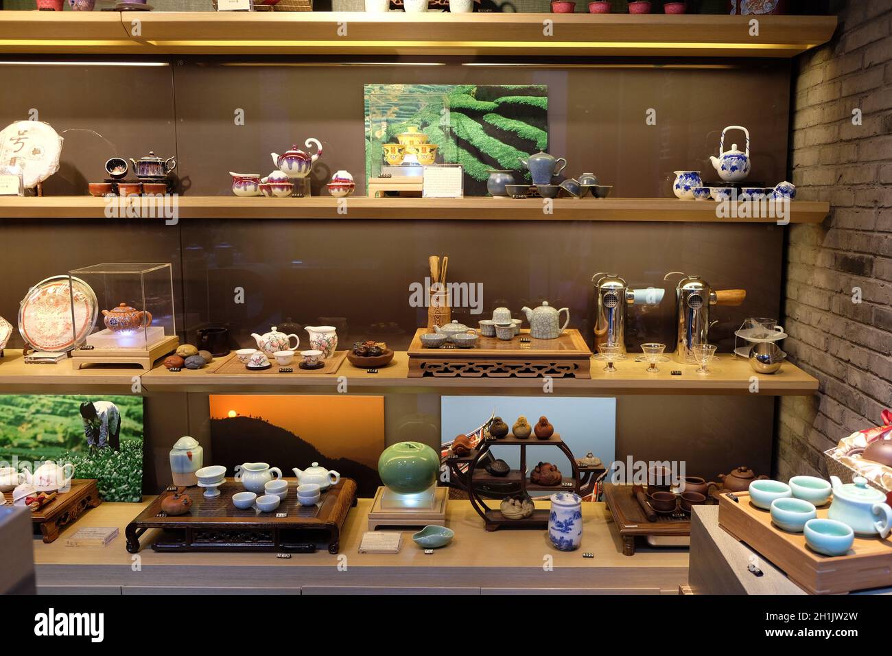 Wide range of traditional Chinese tea on wooden shelves at tea shop in ...