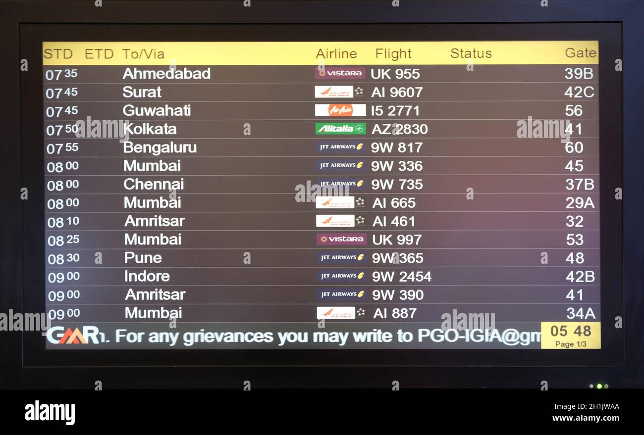 Flight board at the airport in Delhi Stock Photo - Alamy