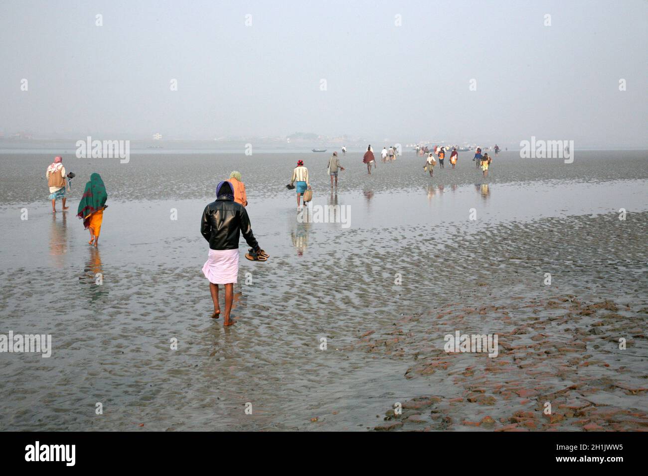During low tide the water in the river Matla falls so low that people ...