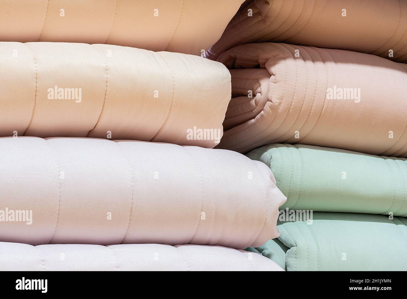 Colorful folded blanket stack closeup picture Stock Photo - Alamy