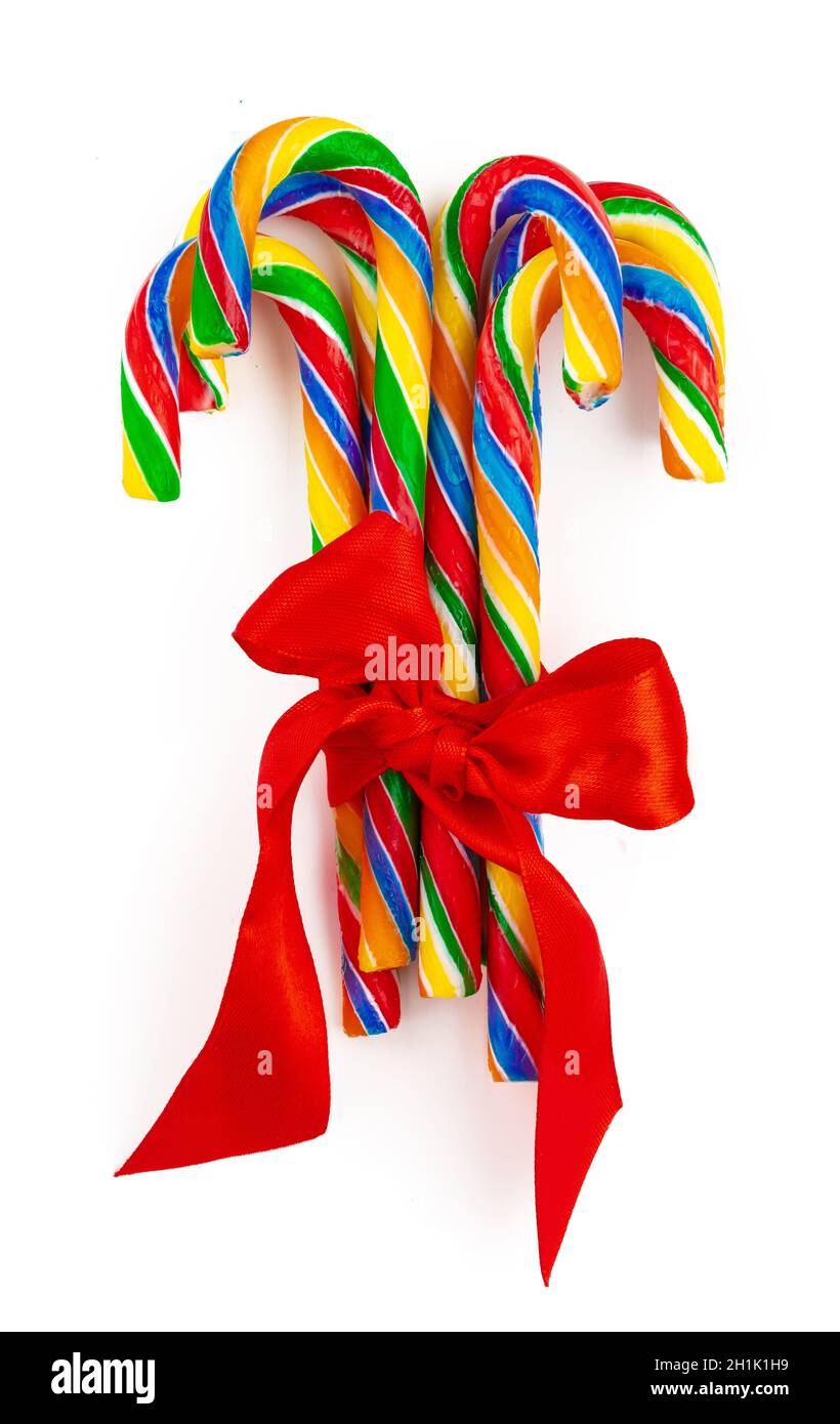 Rainbow colored candy cane isolated on white background Stock Photo - Alamy