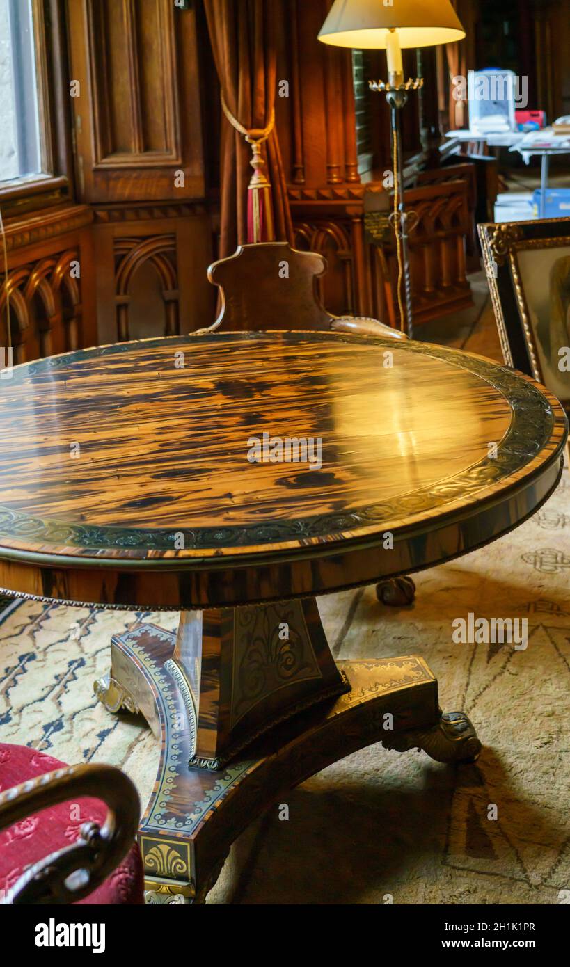 a beautifully appointed library room at Penrhyn Castle, an extensive ...