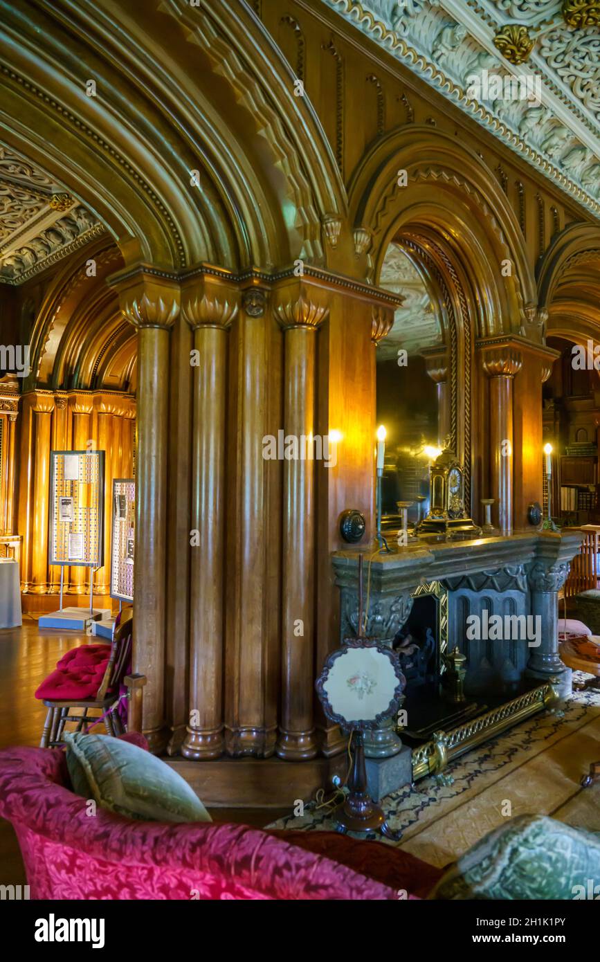 a beautifully appointed library room at Penrhyn Castle, an extensive ...