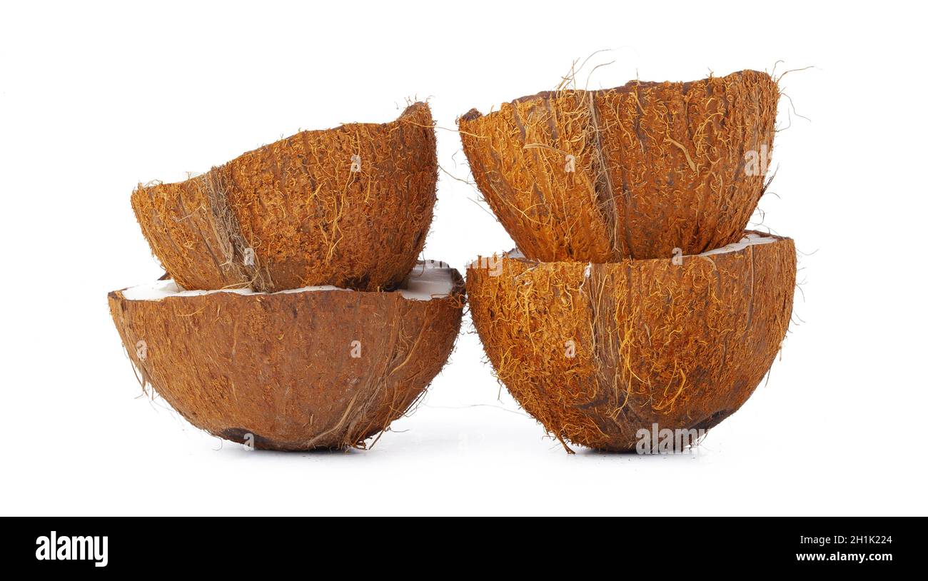 Coco nut halves isolated on white background Stock Photo - Alamy