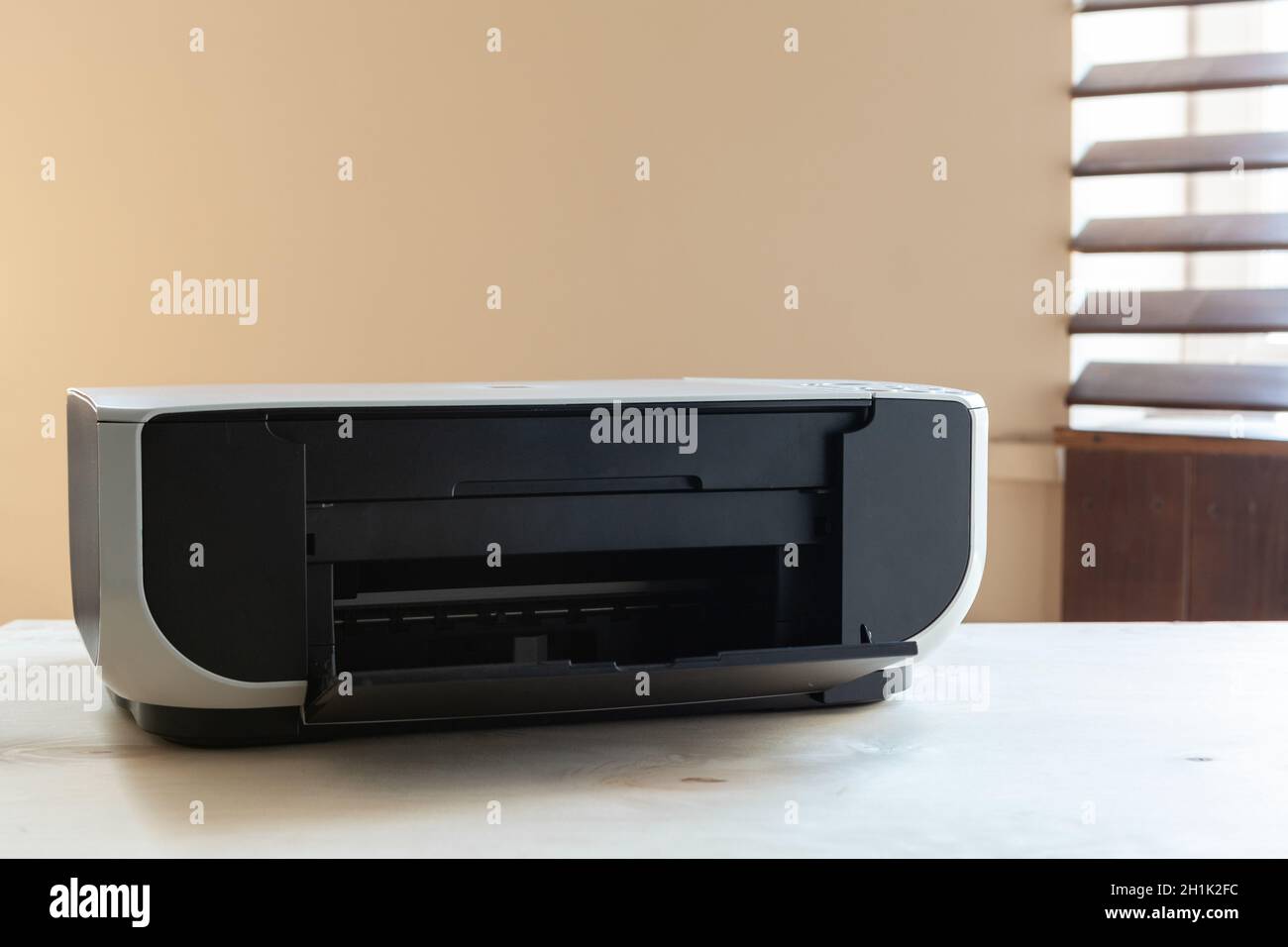 Close up of an office table with printer on it Stock Photo - Alamy