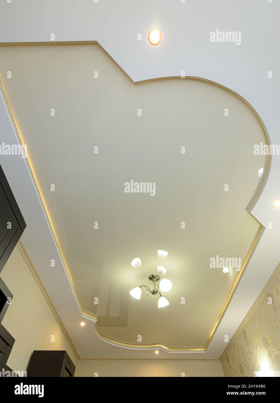 Stretch ceiling with a golden tint with an original shape and design ...