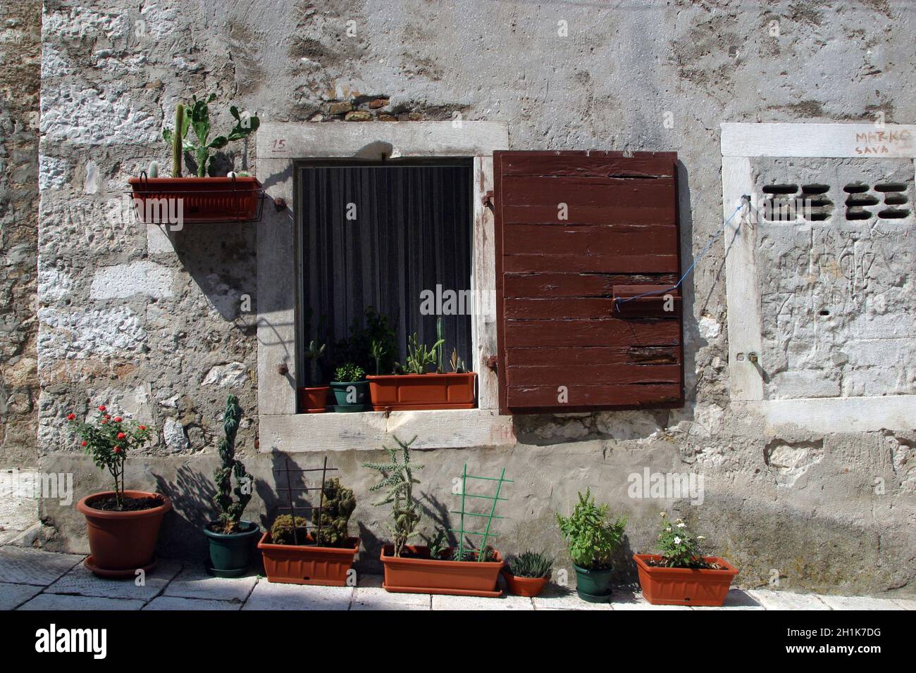 Old house with flowers Stock Photo - Alamy