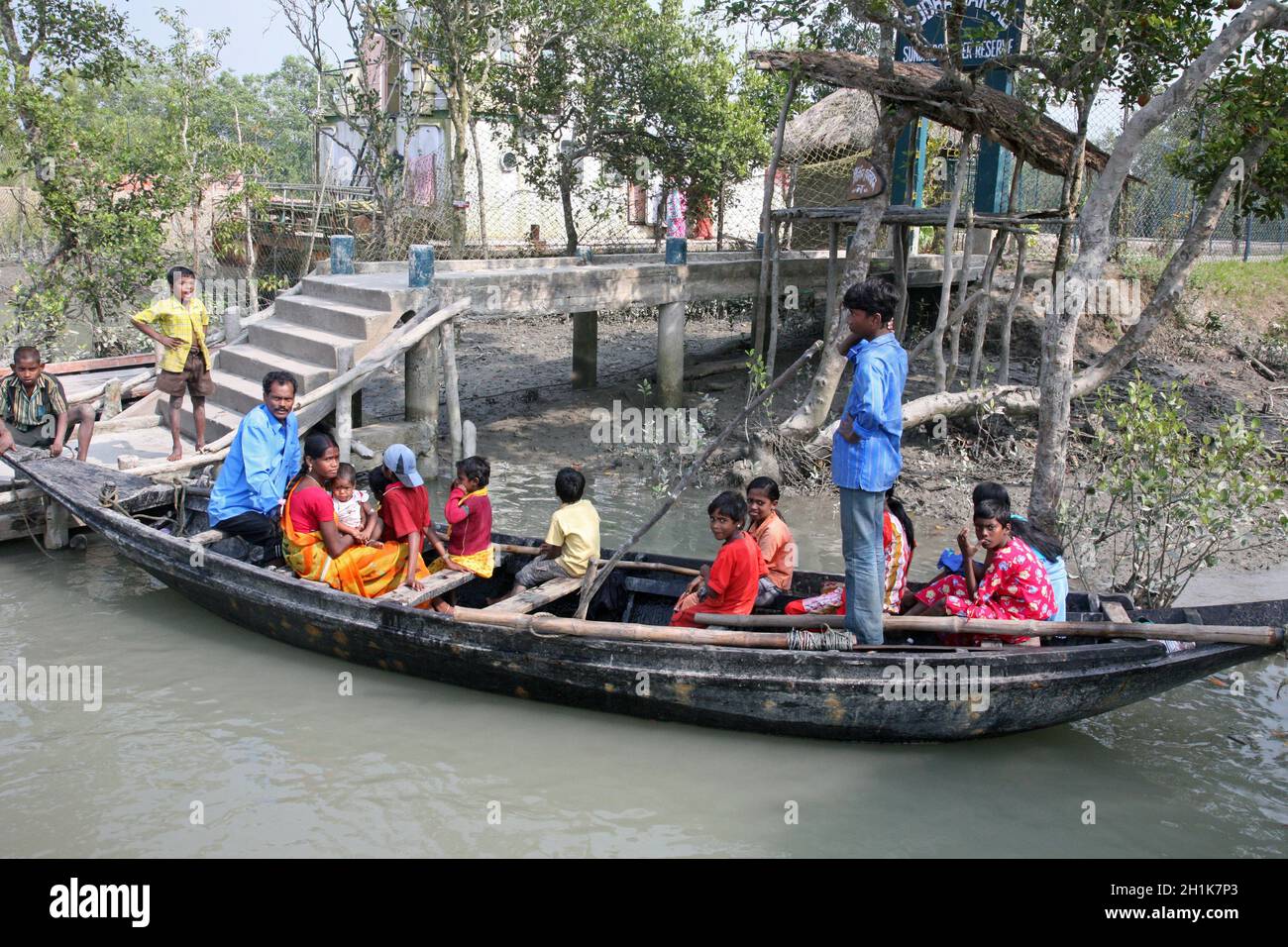 Wooden boat crosses the river in Gosaba, West Bengal, India Stock Photo ...