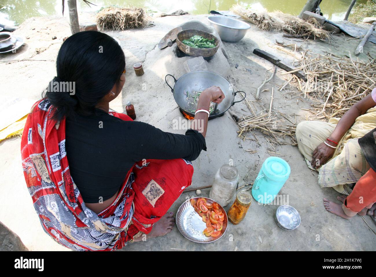 Traditional way of making food on open fire in old kitchen in a village ...