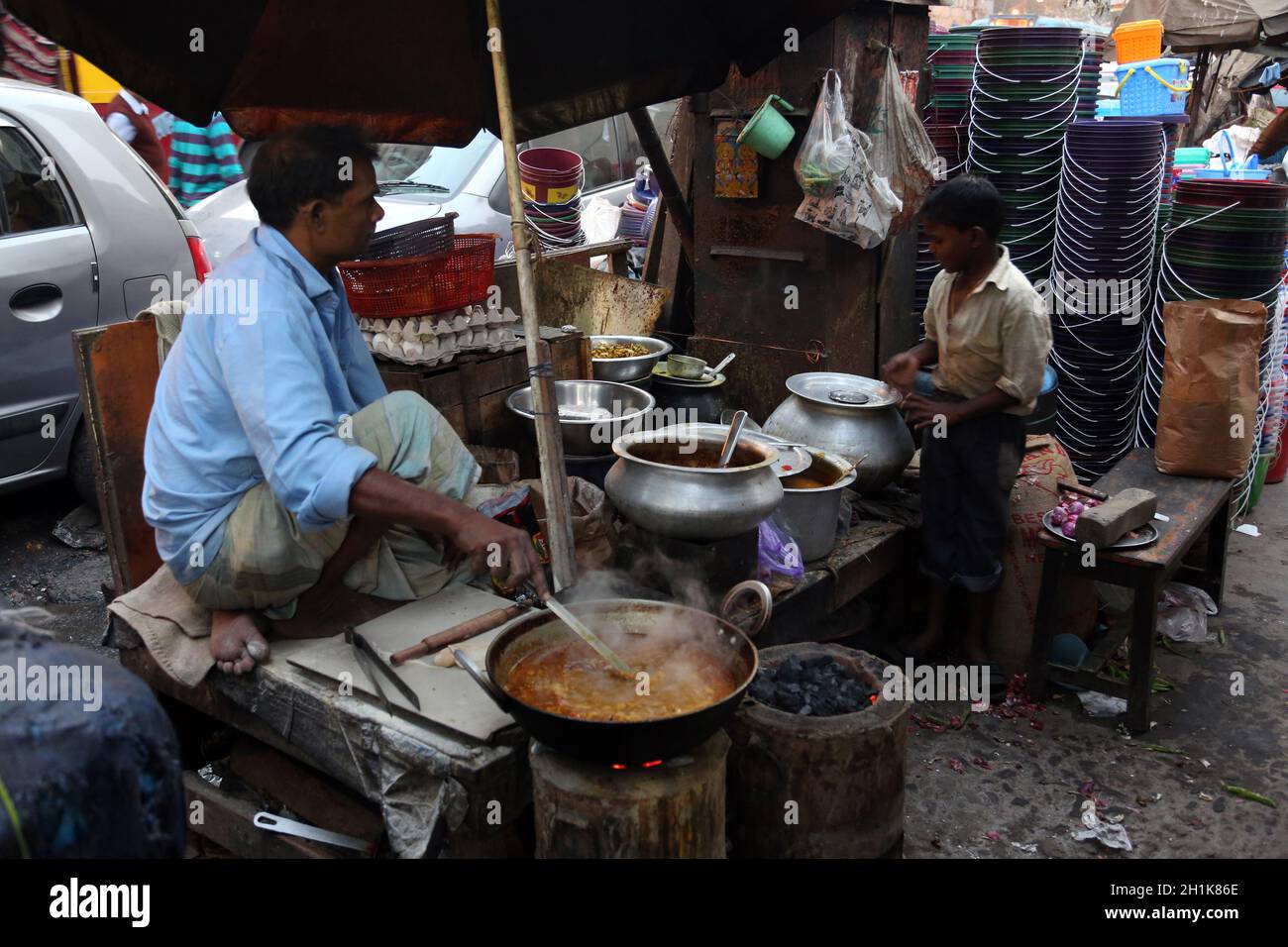 Father and son prepares simple street food outdoor in Kolkata Stock ... Father and son prepares simple street food outdoor in Kolkata Stock ...