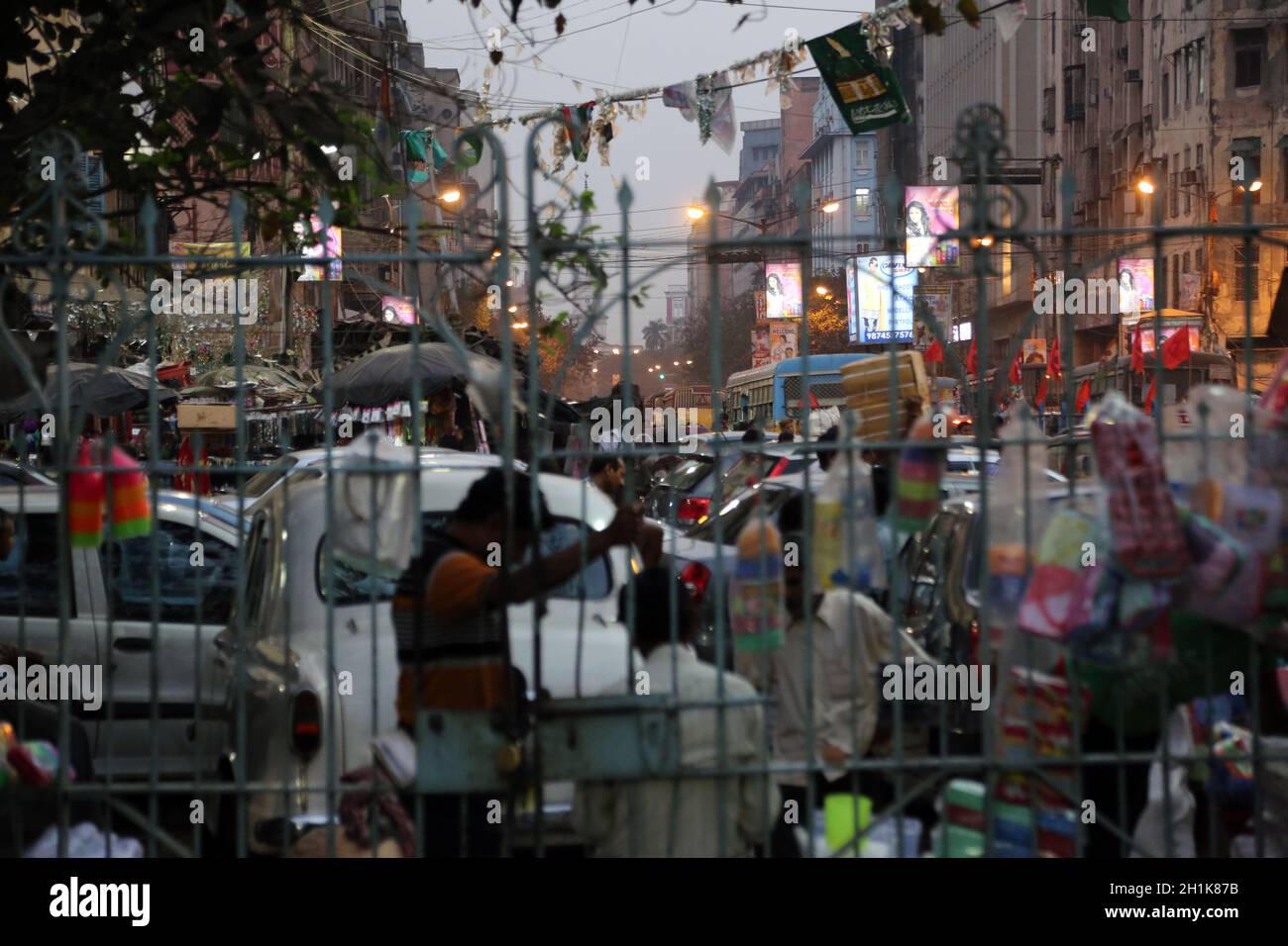Dark city traffic blurred in motion at late evening on crowded streets ...