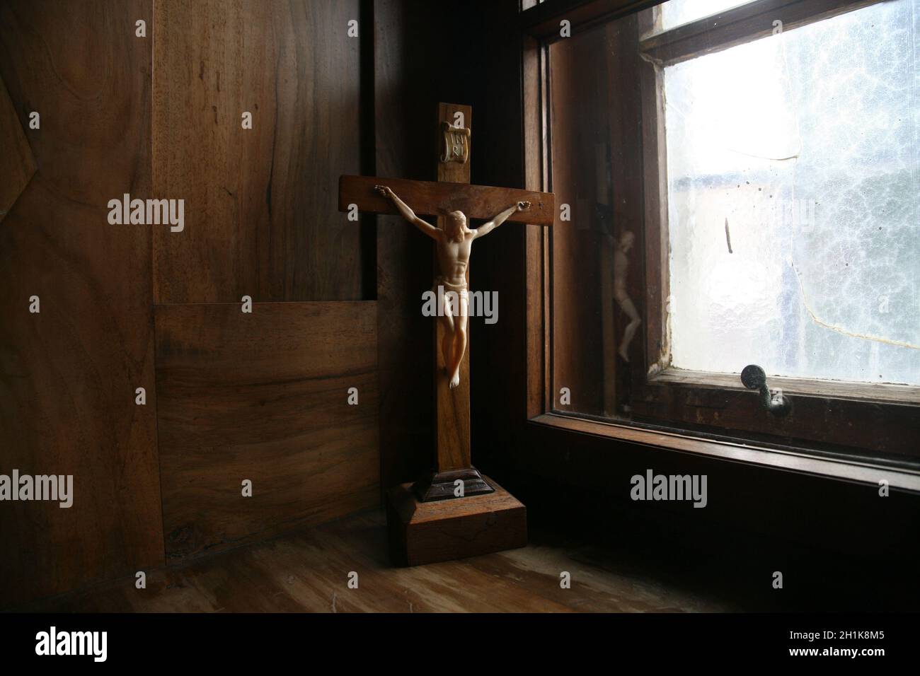 Cross at the window Stock Photo - Alamy