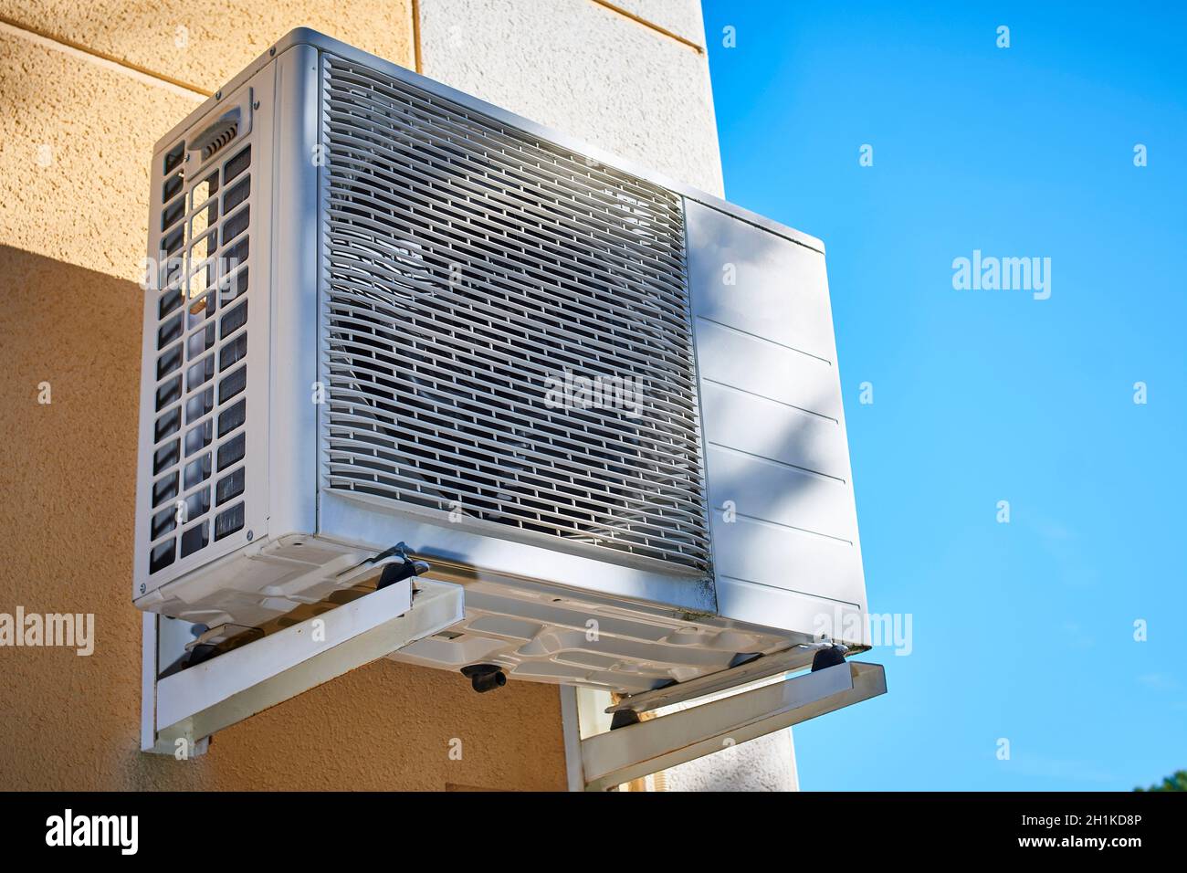 Air conditioning and heating machine installed outside a house, on the ...