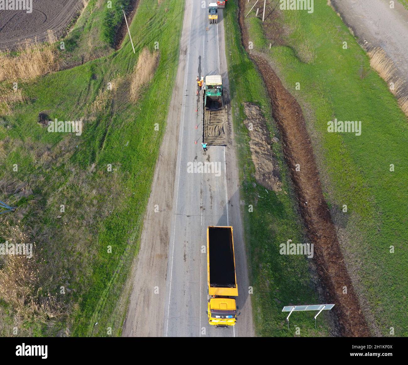 Top view of the road repair. Technics for repair of asphalt ...