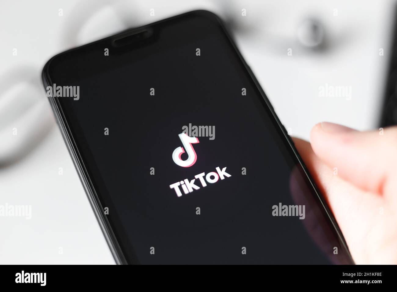 Hand with smartphone and tik tok hi-res stock photography and images ...