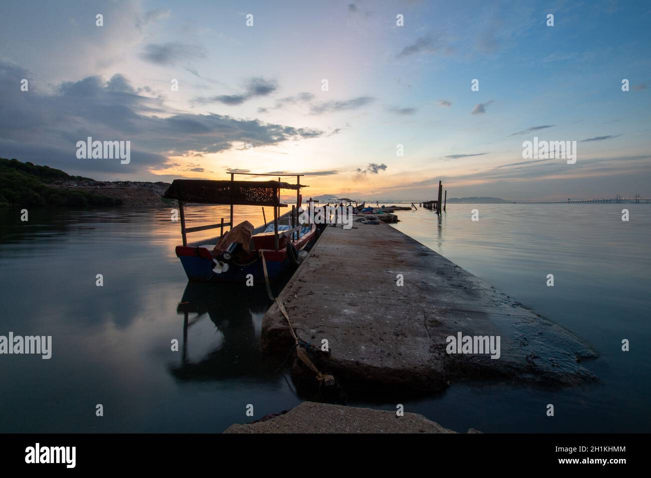 Cement fisherman jetty Jelutong, Penang, Malaysia during sunrise Stock ...