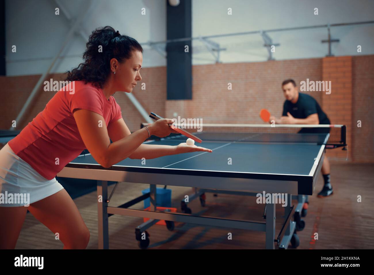 Table tennis, male and female ping pong players. Couple playing table ...