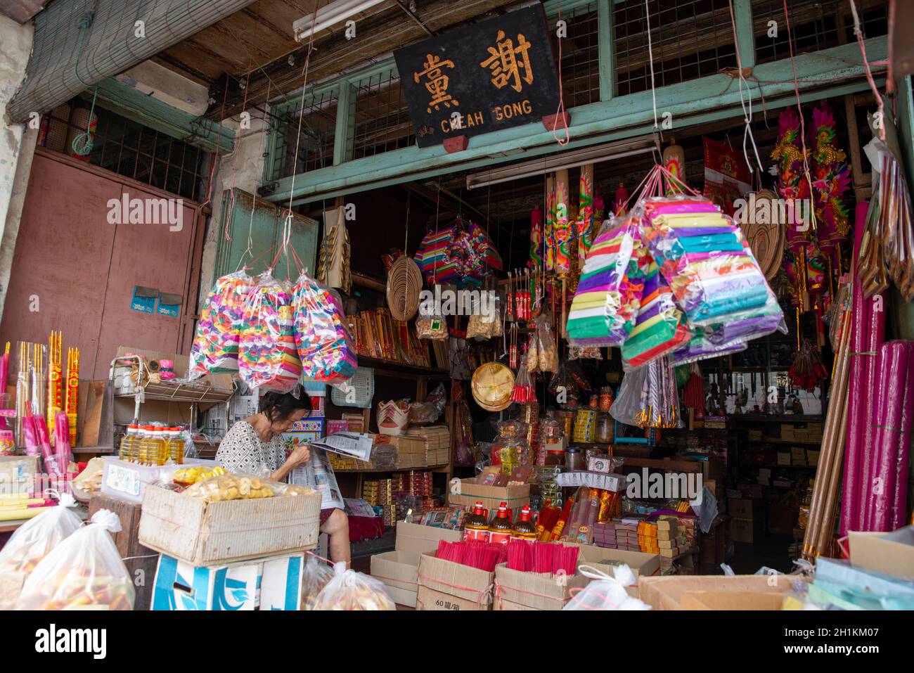 Georgetown, Penang/Malaysia - Aug 07 2016: A woman read newspaper at ...