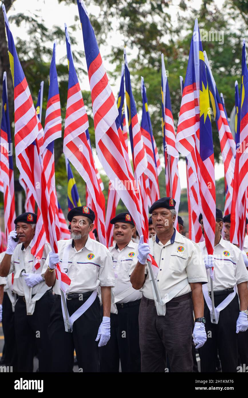Georgetown, Penang/Malaysia - Aug 31 2016: Veteran hold the flag during ...