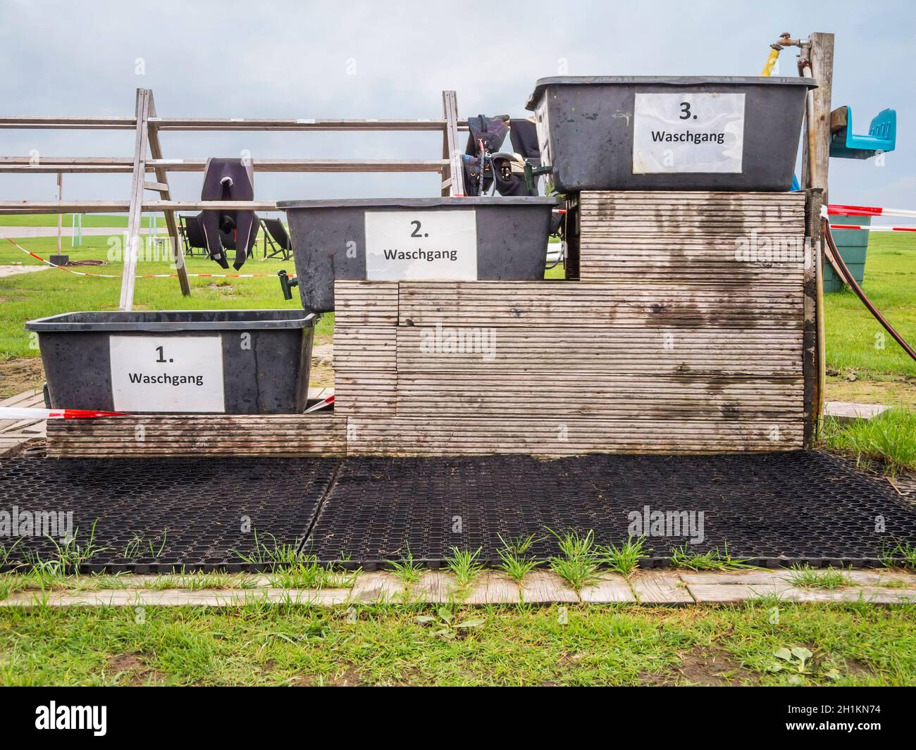 View of a manual washing machine for wetsuits on the North Sea beach in ...
