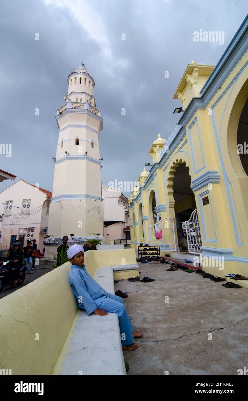 George Town, Penang/Malaysia - Jul 19 2018: Muslim kid sit outside ...