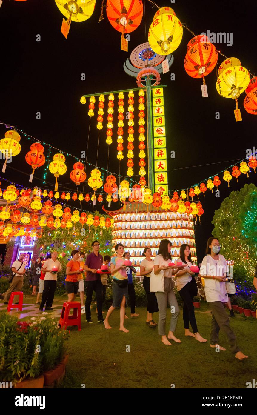 Georgetown, Penang/Malaysia - Feb 20 2020: Devotees light up lantern at ...