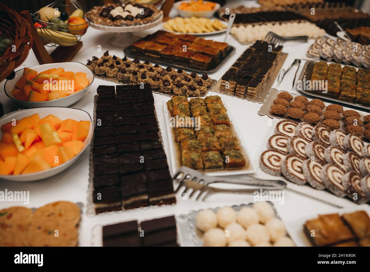 Beautifully arranged table with pastries at an event Stock Photo - Alamy