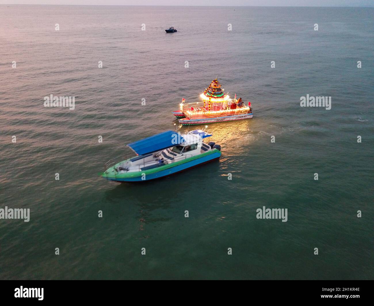 Teluk Bahang, Penang/Malaysia - Mar 08 2020: A boat pass over floating ...