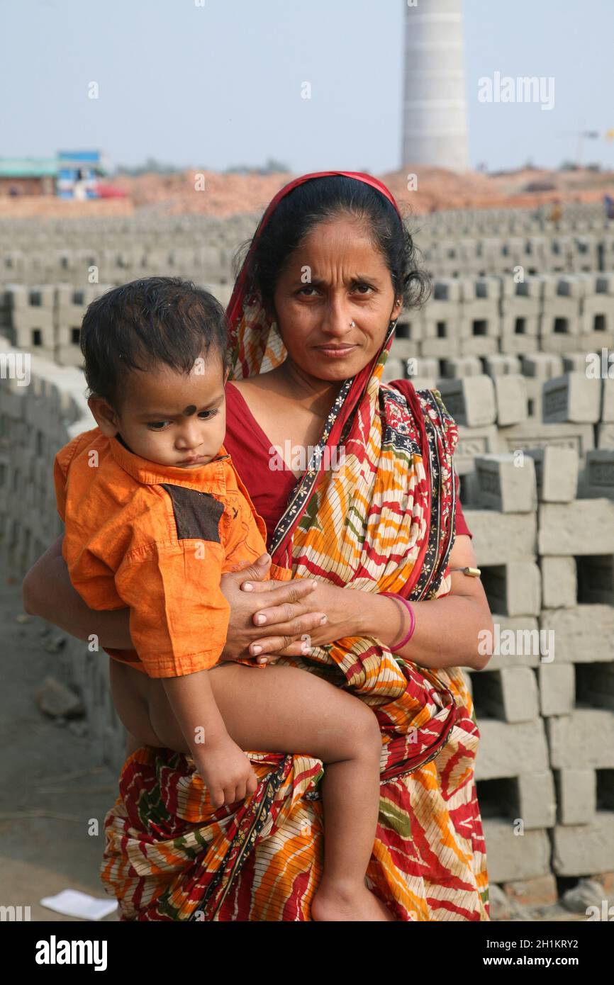 Workers live with their families within the brick factory, where they ...