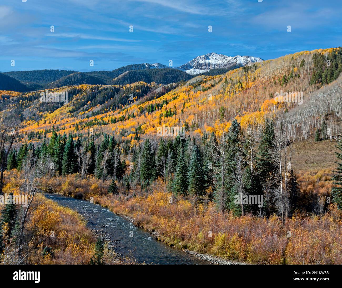 Vibrant fall scenery and mountain backdrop along the south fork of the ...