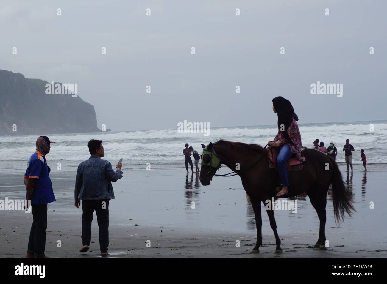 people vacation on parang tritis, yogyakarta, indonesia Stock Photo - Alamy