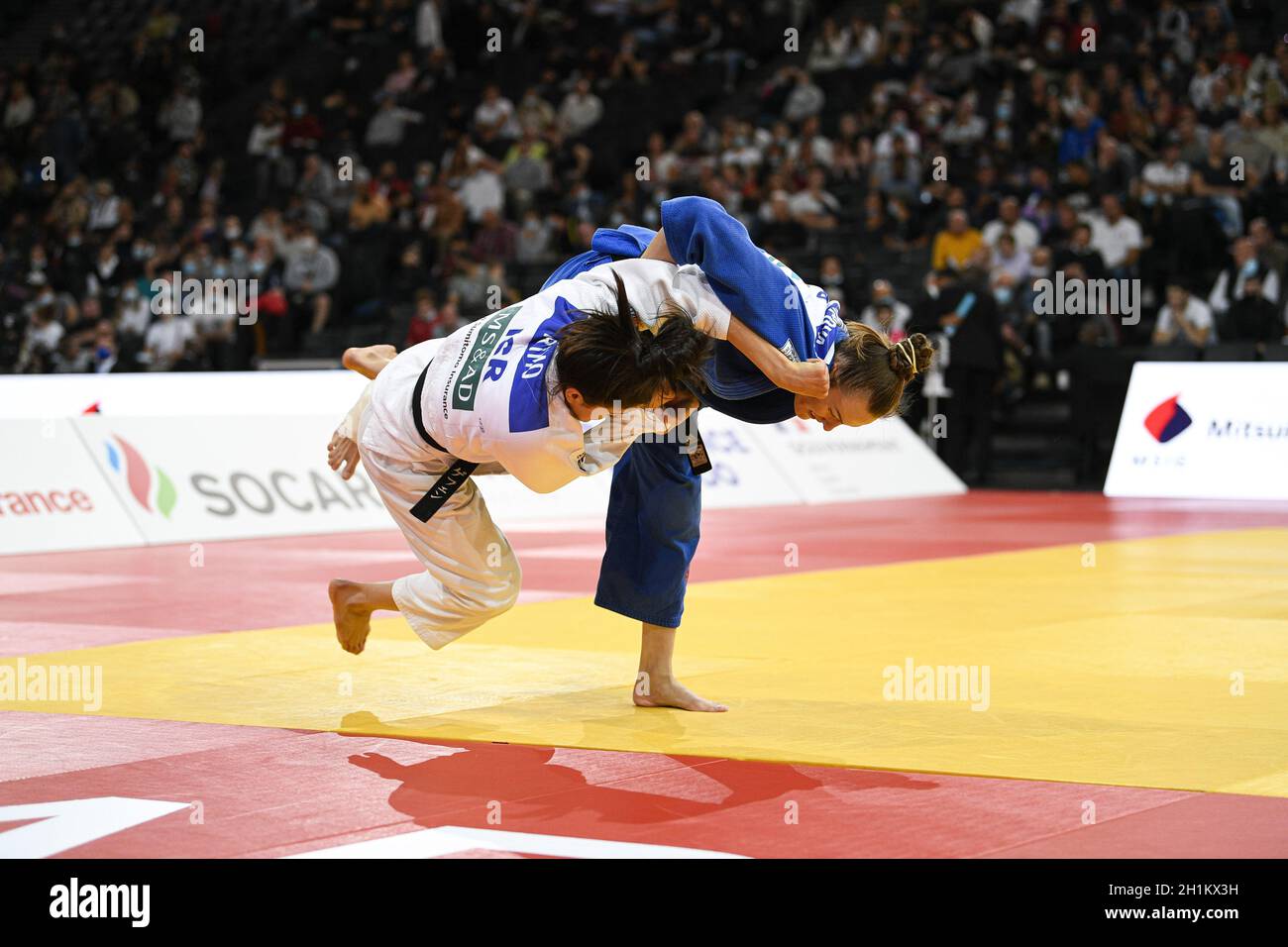 Women -52 kg, Anastasia POLIKARPOVA of Russia (blue) throws Gefen PRIMO ...