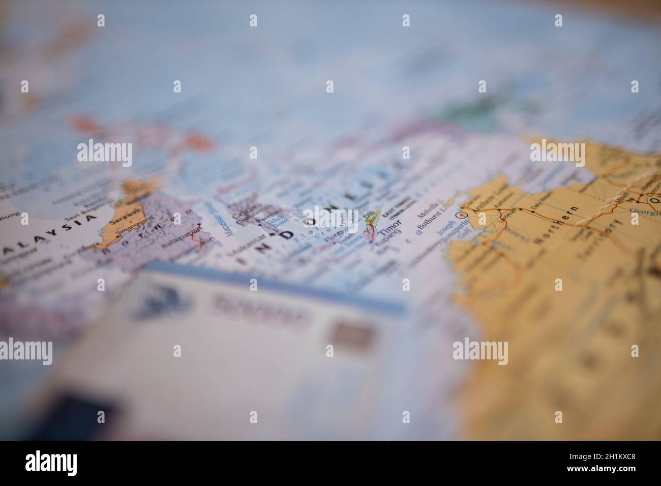 Fifty thousand Indonesian rupiah bill next to Indonesia on a map of ...