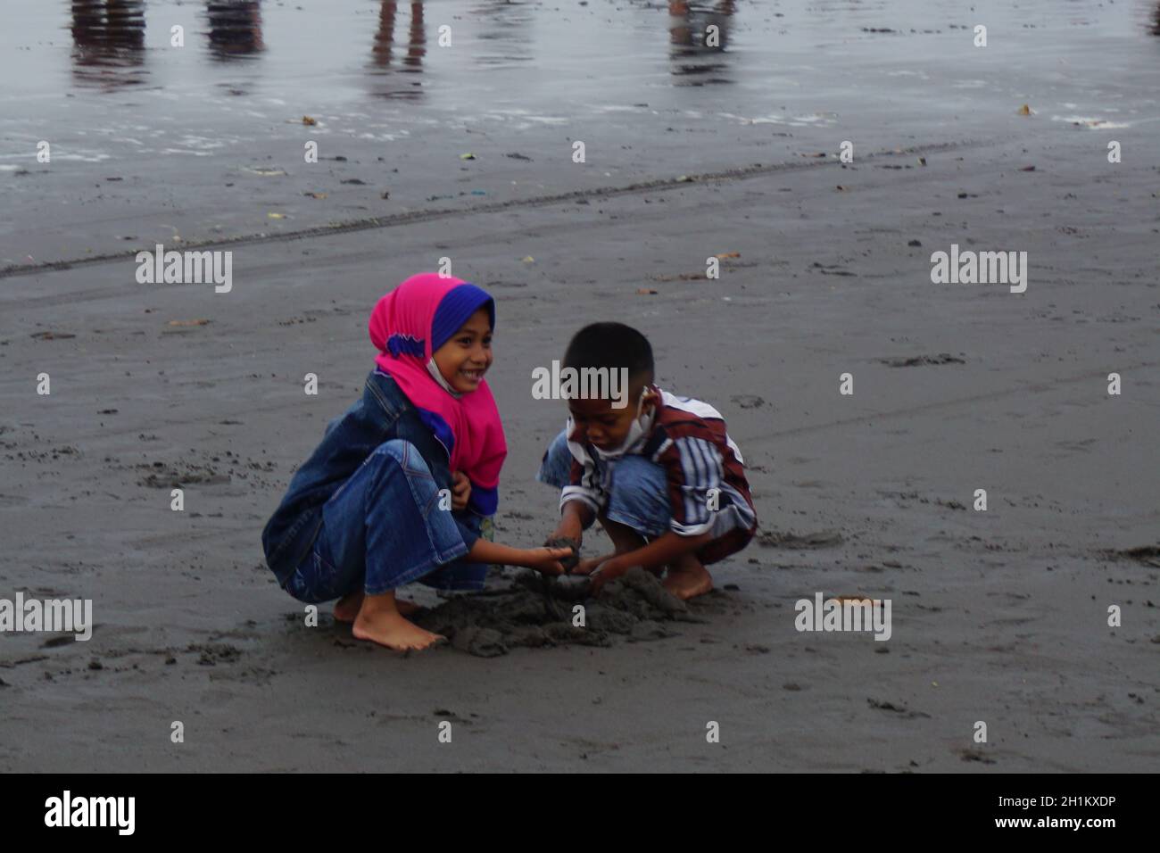 people vacation on parang tritis, yogyakarta, indonesia Stock Photo - Alamy