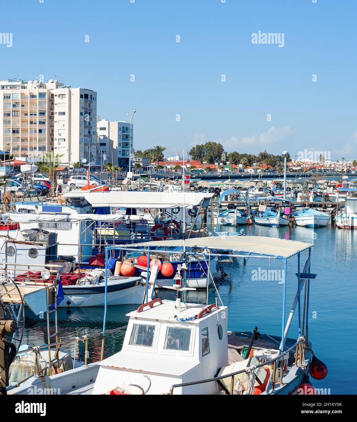 Marina with yachts and cityscape of Larnaca with waterfront apartments ...