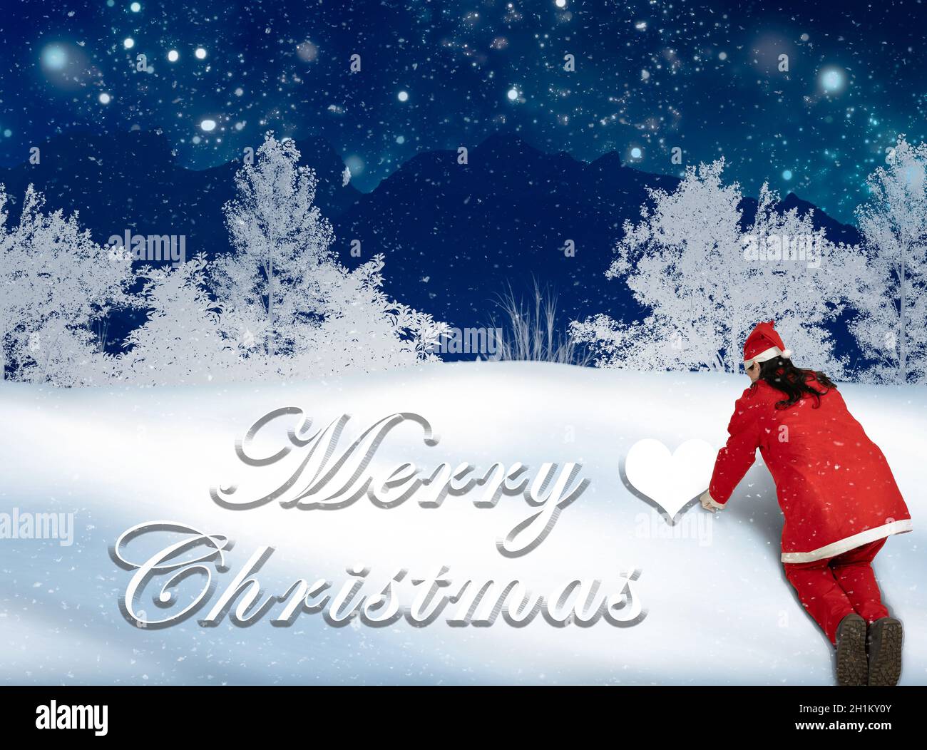 an elf on his knees writes the text merry christmas in a winter ...