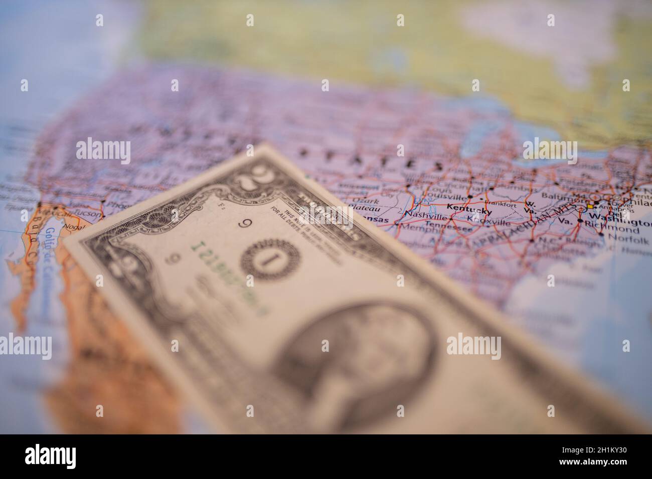 Close up picture of a two-dollar banknote on top of a map of the United ...