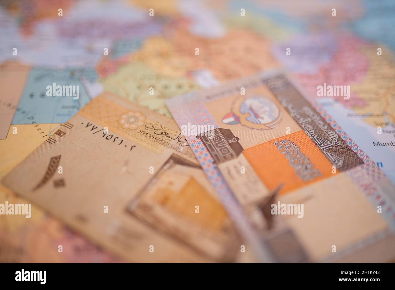 Ten Saudi riyals next to a Kuwaiti Quarter Dinar -the words Bank of ...