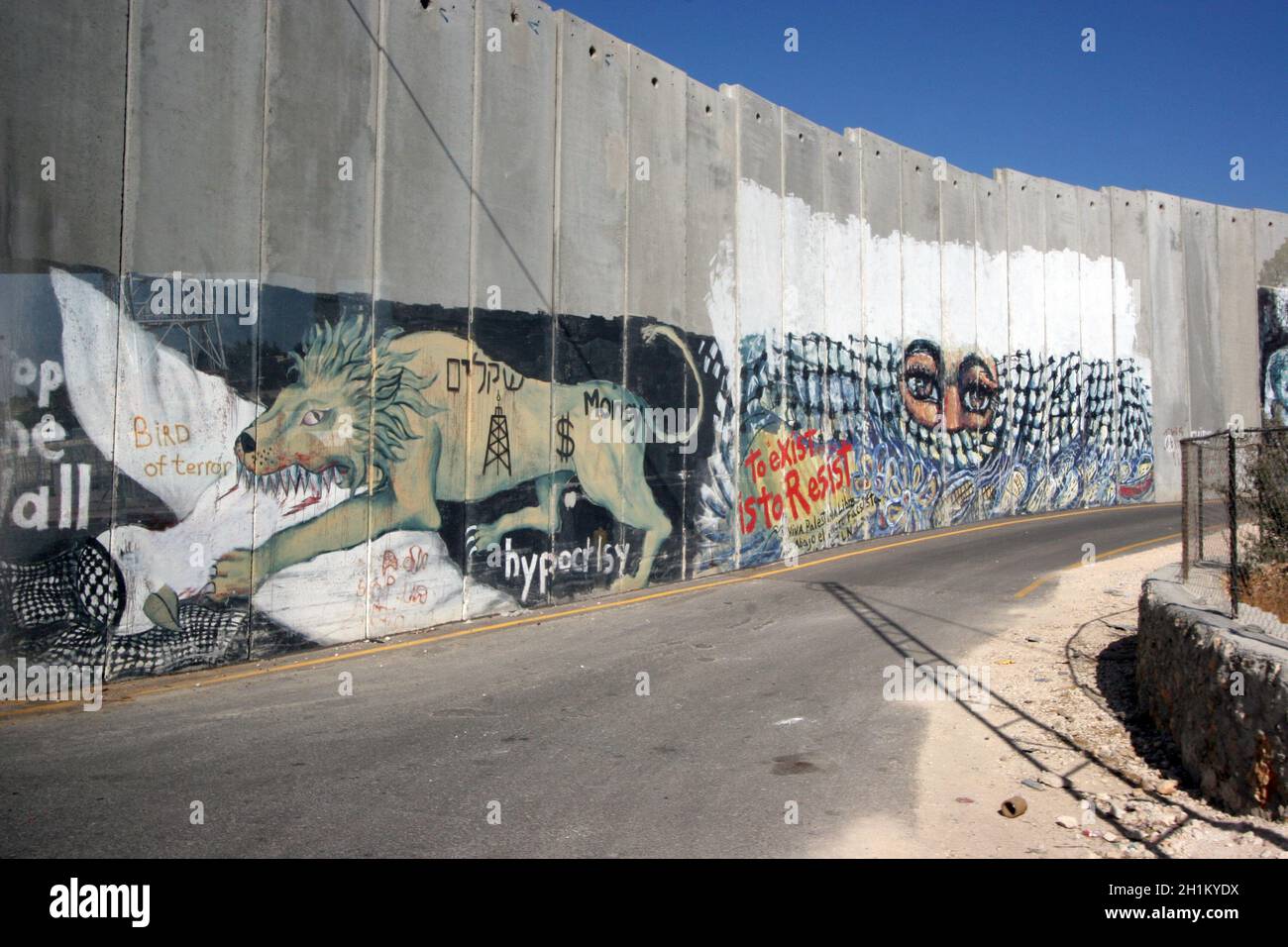 Activist graffiti adorns the Israeli separation wall in the West Bank ...