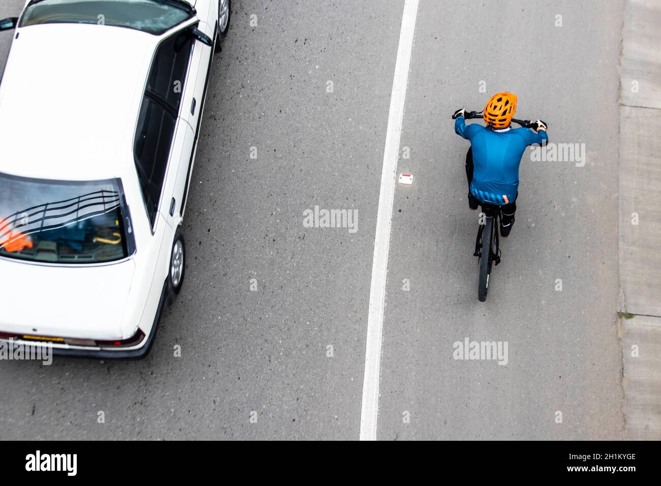 Car overtaking a bike hi-res stock photography and images - Alamy