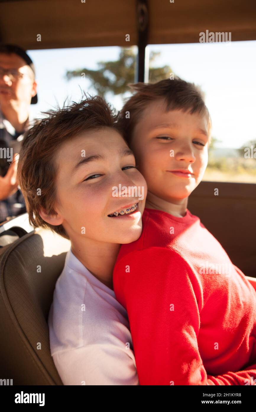 Tween brothers together on safari Stock Photo - Alamy