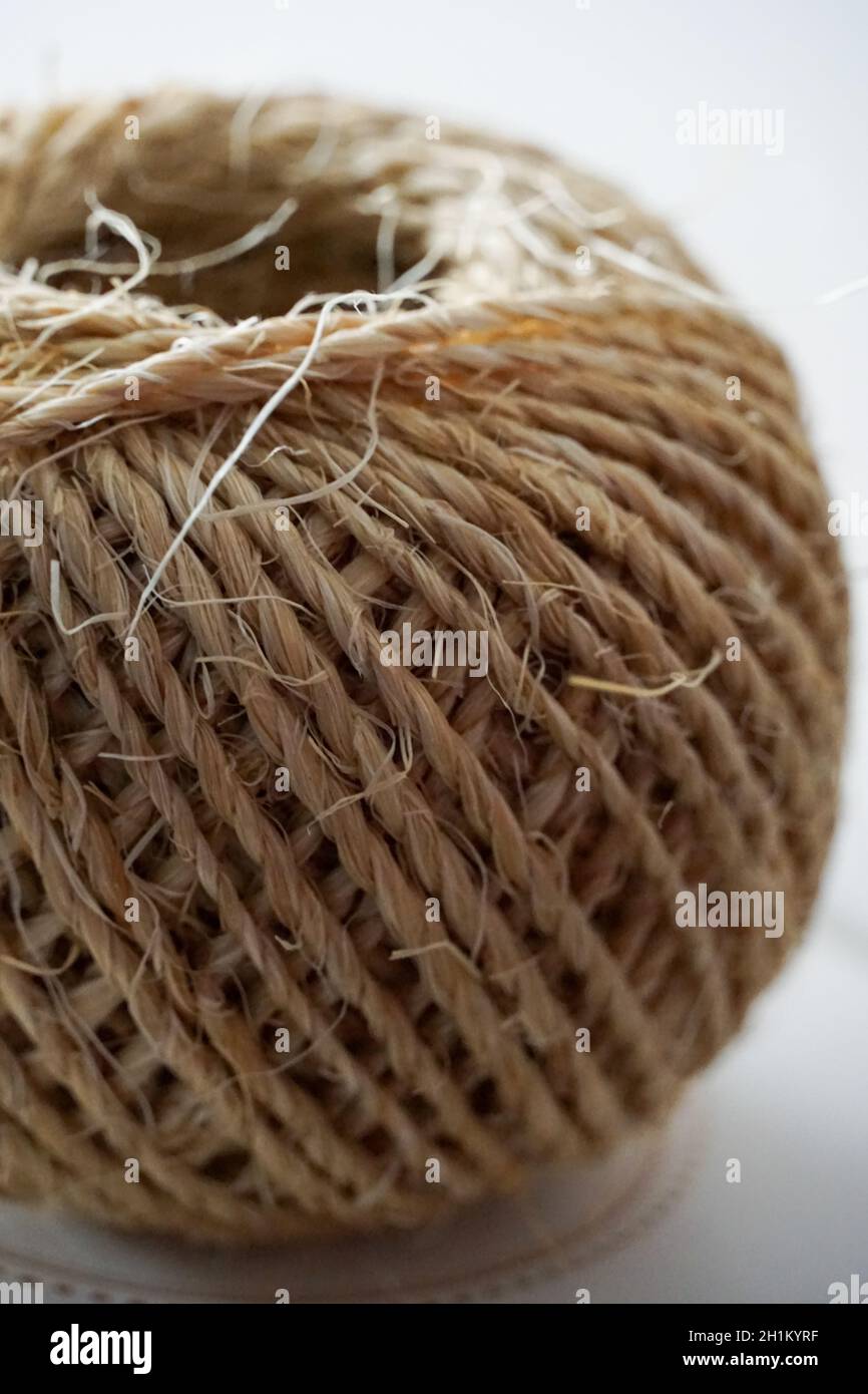 Vertical shot of a ball jute rope on a white background Stock Photo - Alamy